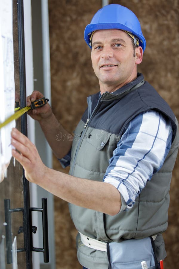 Man Measuring Window in Renovation Property Stock Image - Image of ...