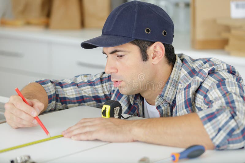 Man Measuring Wood with Tape Measure Stock Image - Image of centimeter ...