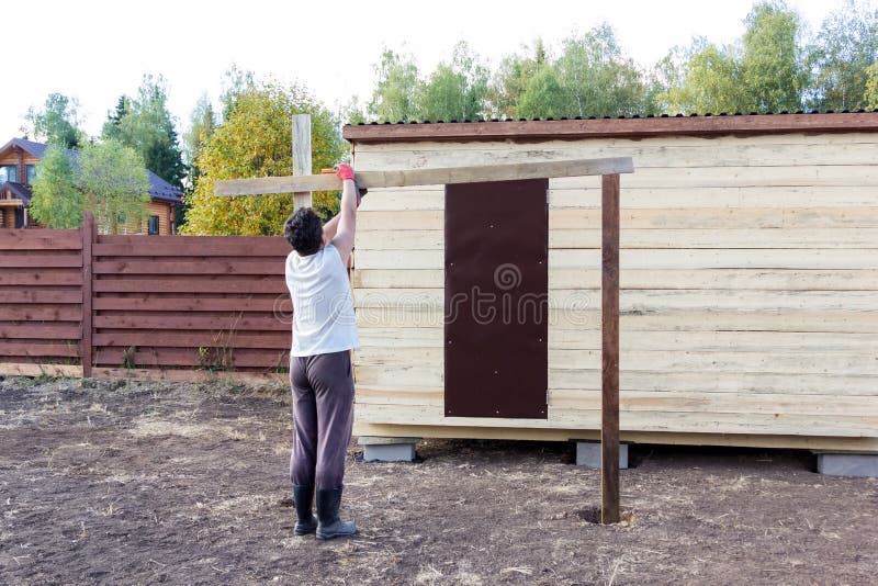 Man Measuring Wooden Post on the Level Stock Photo - Image of ...