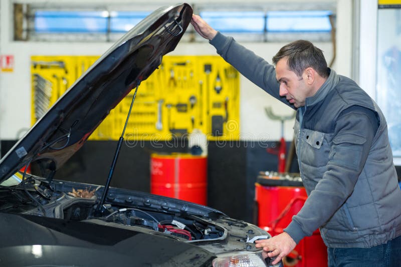 Man Mechanic Repairing Car in Garage Stock Image - Image of male, work ...