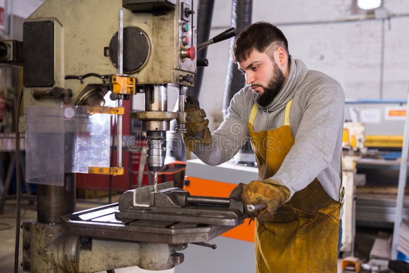 Man Mechanic Using Drilling Machine in Workshop Stock Photo - Image of ...