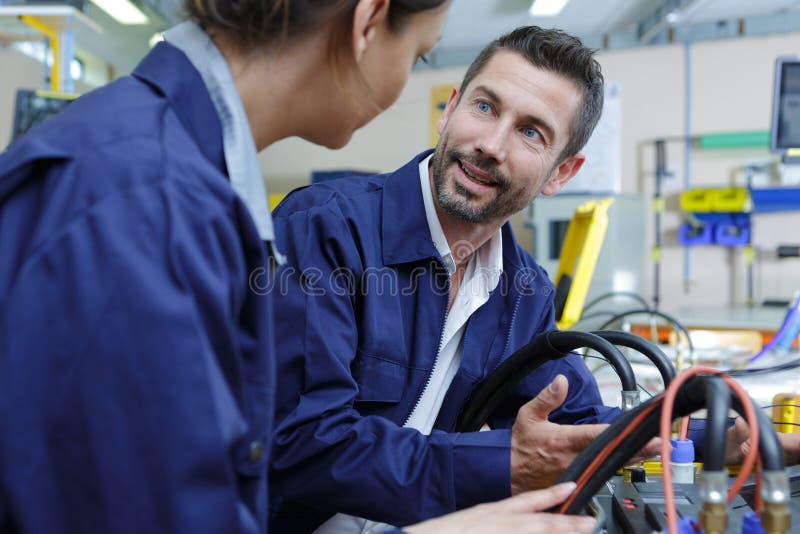 Man Mechanic and Woman Talking about Work Stock Image - Image of ...