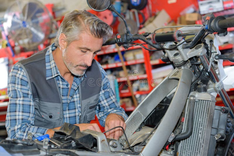 Man Mechanic Working on Adjustments Motorcycle Stock Image - Image of ...