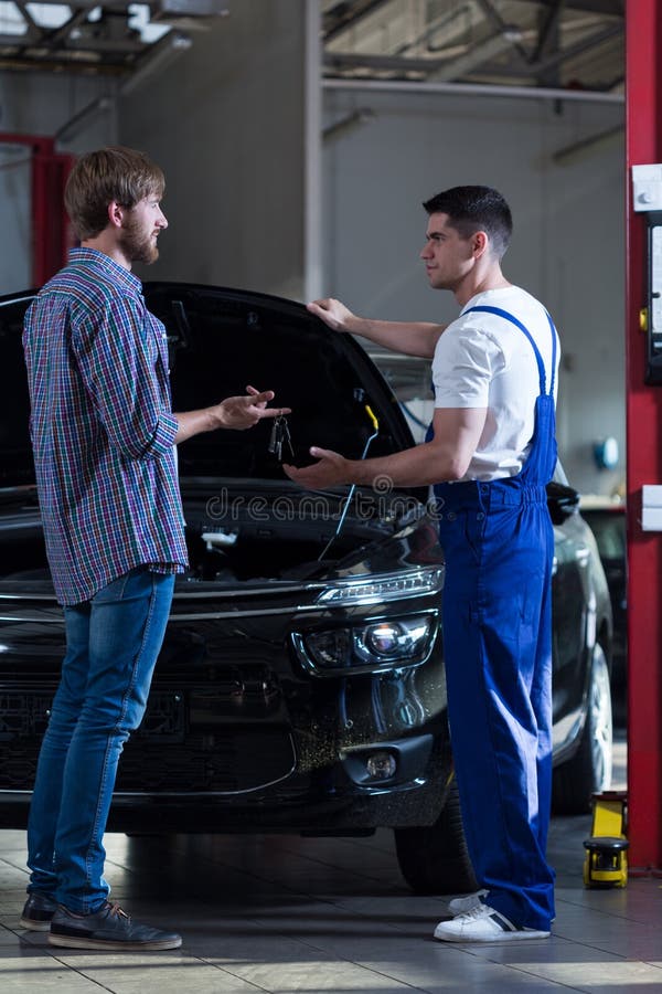 Man and Mechanic at Workshop Stock Photo - Image of station, service ...