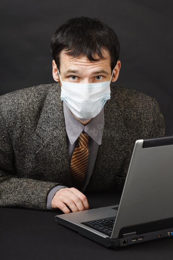 Man in Medical Mask Works in Internet Stock Photo - Image of jacket ...