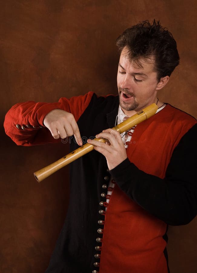 Man in a Medieval Suit Plays a Flute Stock Image - Image of human ...