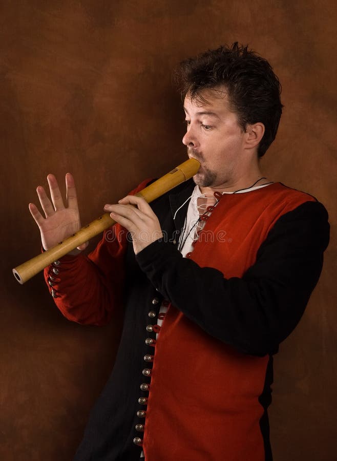 Man in a Medieval Suit Plays a Flute Stock Photo - Image of mature ...