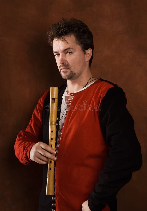 Man in a Medieval Suit Plays a Flute Stock Image - Image of minstrel ...