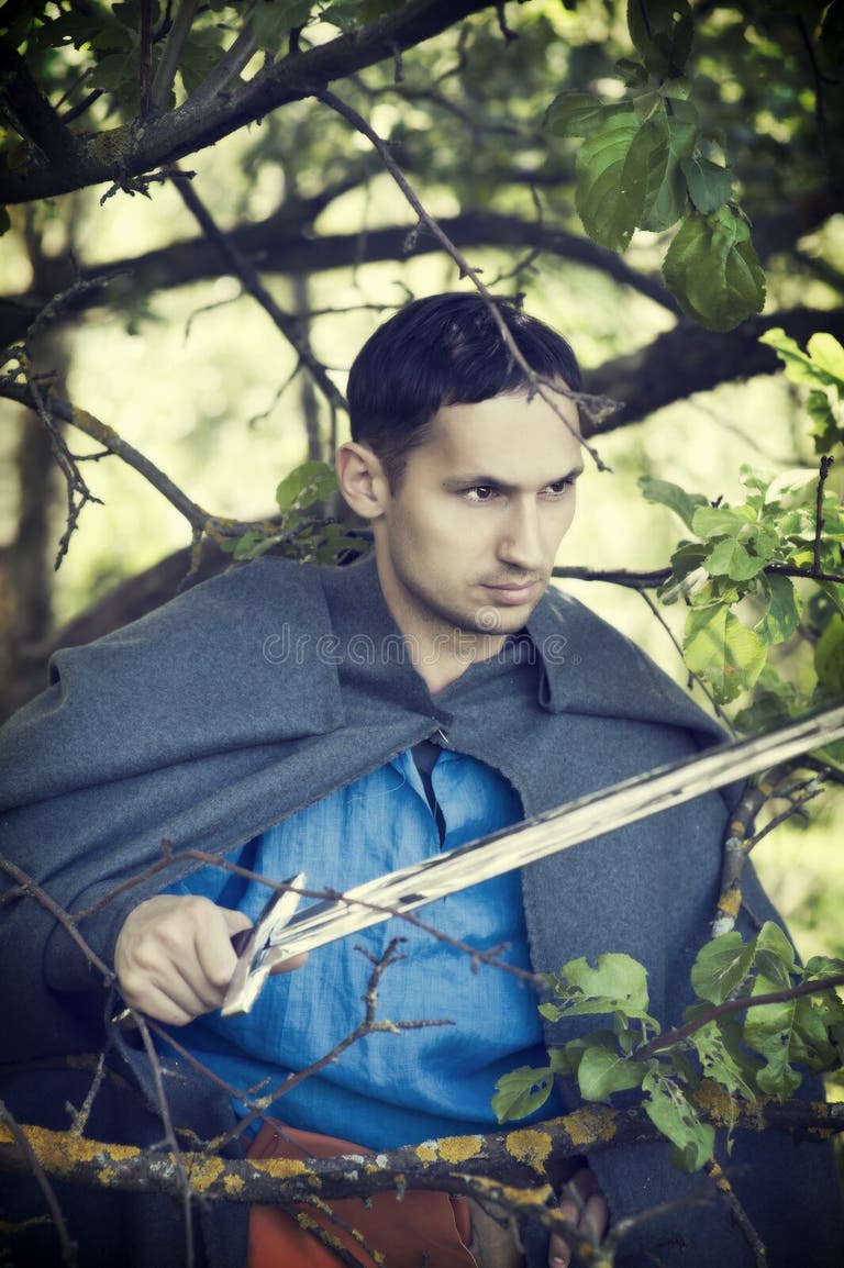 1,194 Young Man Holding Sword Stock Photos - Free & Royalty-Free Stock ...