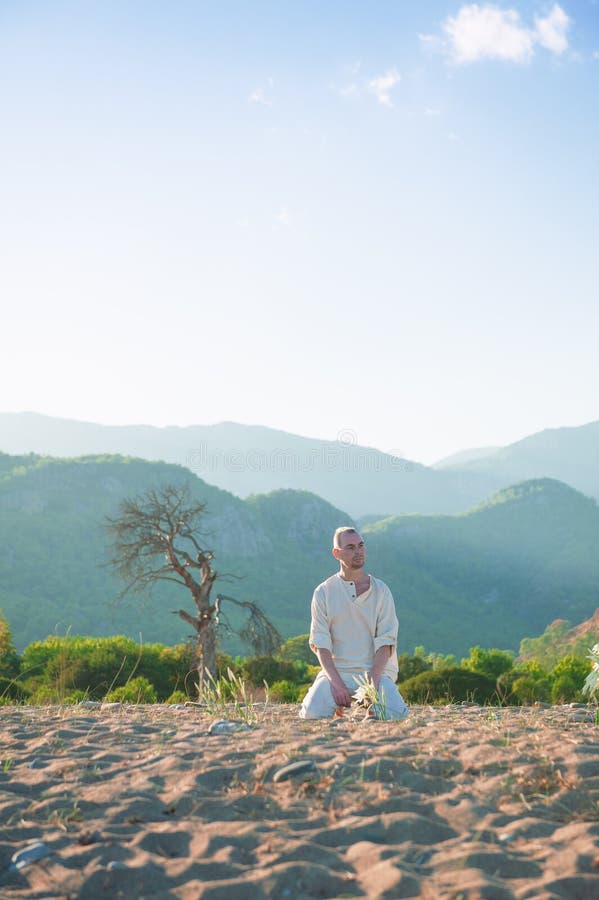 Man Meditates Vast Desert Landscape Surrounded Mountains Stock Photos ...