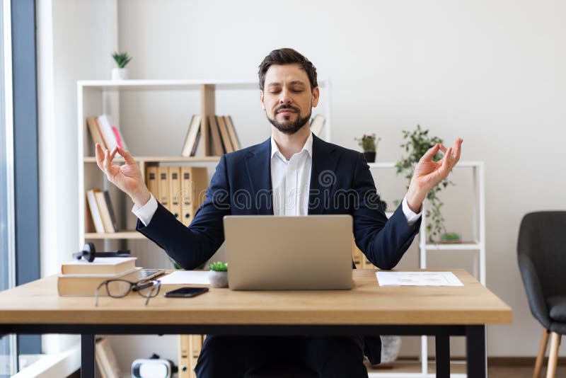 Man Meditating at Computer Desk Practicing Mindfulness in Modern Office ...