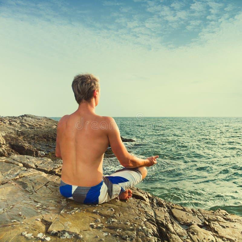 Man Meditating in Front of Sea Stock Image - Image of person, spiritual ...