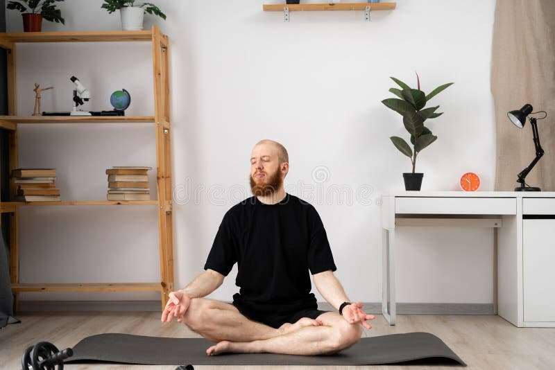 Man Meditating in Home Office, Finding Inner Peace Amidst Work Items ...