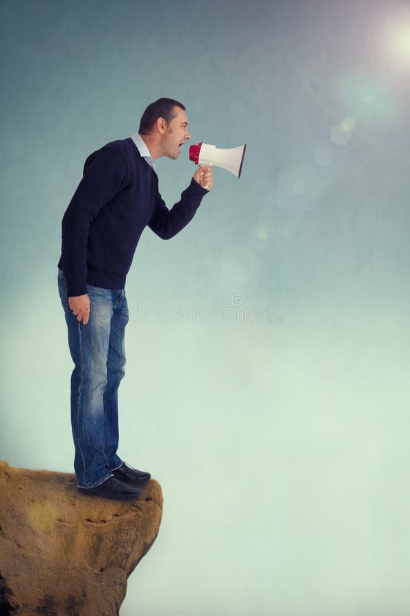 Man with Megaphone Shouting from Cliff Edge Stock Photo - Image of ...
