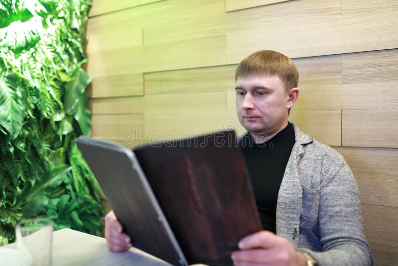 Man with menu book stock photo. Image of choice, european - 133937290