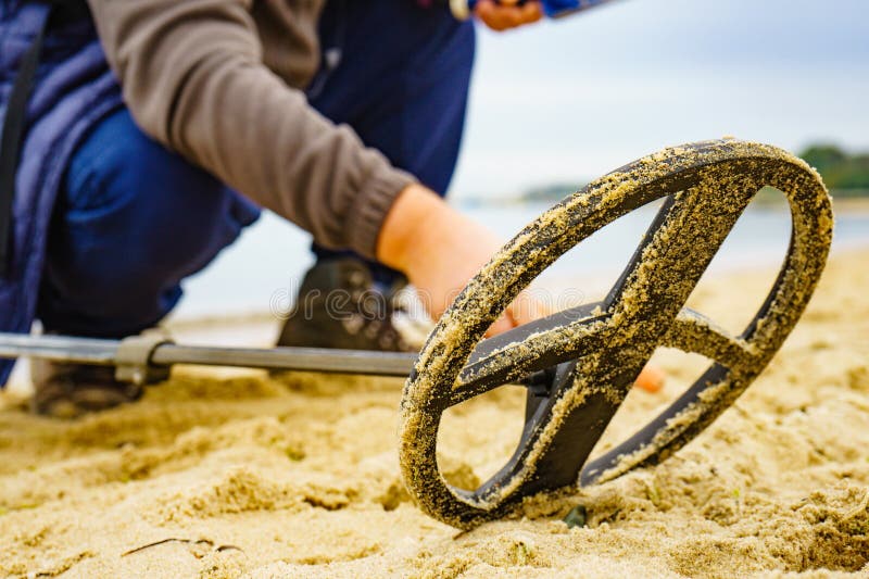 Man with Metal Detector on Sea Beach Stock Photo - Image of sandy, coil ...
