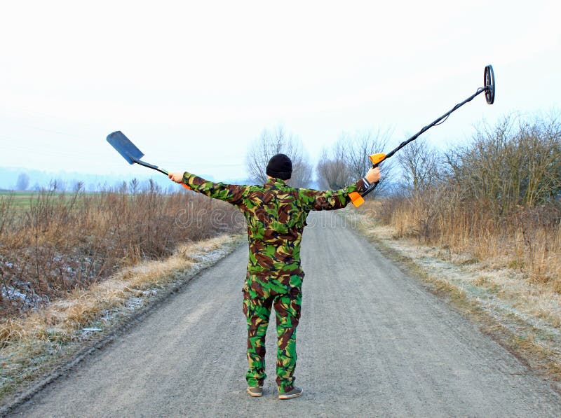 Man with metal detector . stock photo. Image of money - 66969030