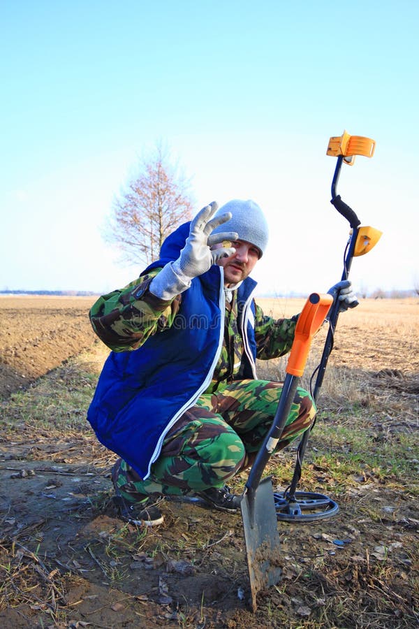 Man with metal detector . stock photo. Image of detector - 66969798