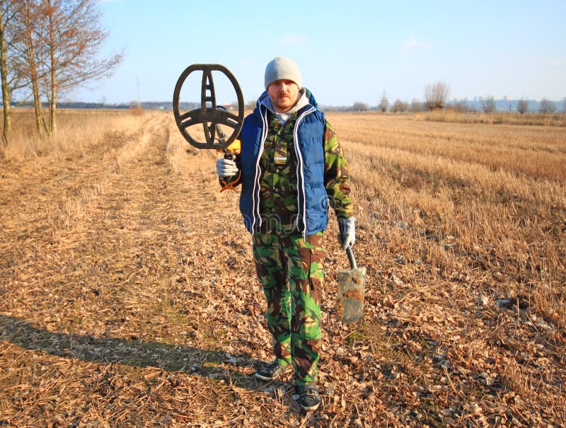 Man with metal detector stock photo. Image of archeology - 57025402