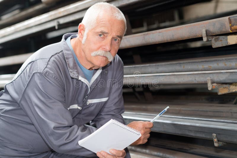 Man in Metal Industry Warehouse Checking Products Stock Image - Image ...