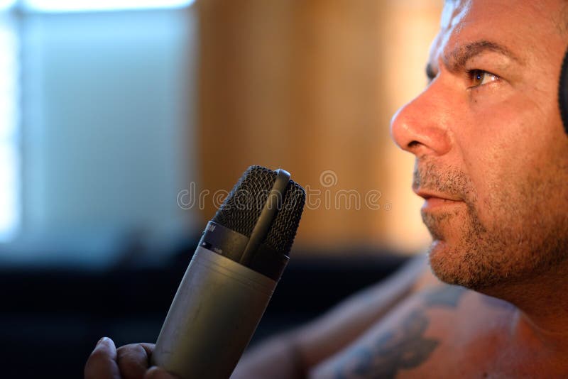Man with microphone stock image. Image of record, sound - 57992649