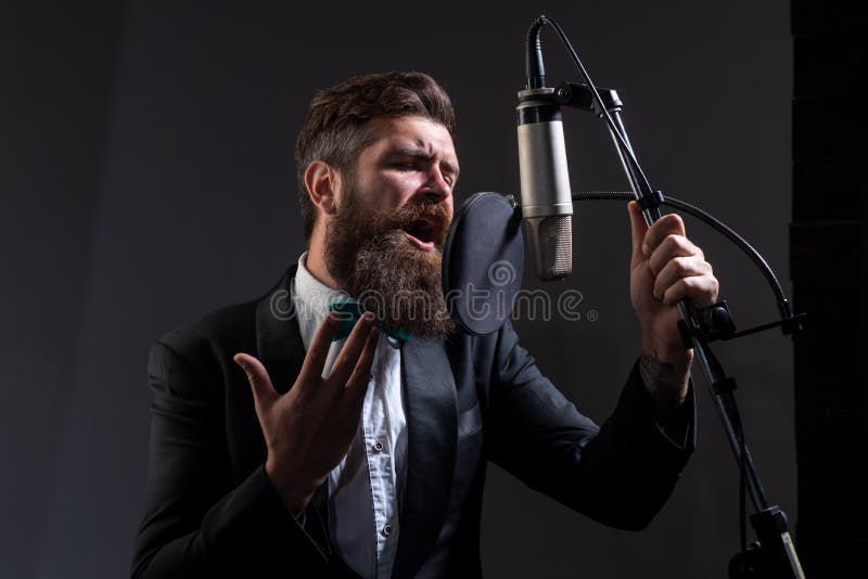 Man with Microphone Singing in Music Hall. Stock Image - Image of jazz ...