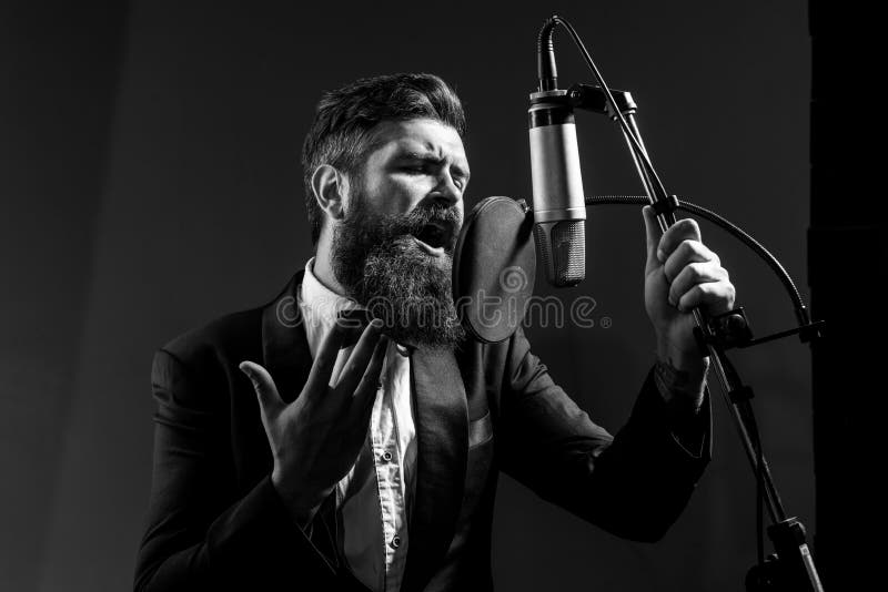 Man with Microphone Singing in Music Hall. Stock Photo - Image of ...