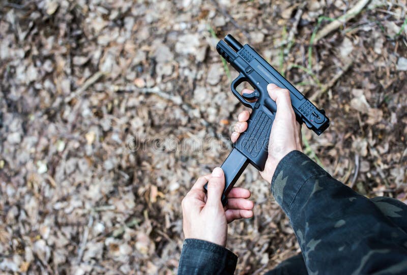 Man in Military Clothes Loading a Gun Stock Photo - Image of horizontal ...