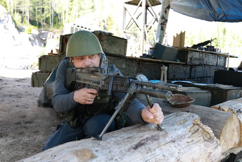 Man in Military Helmet with Machine Gun Stock Photo - Image of ...