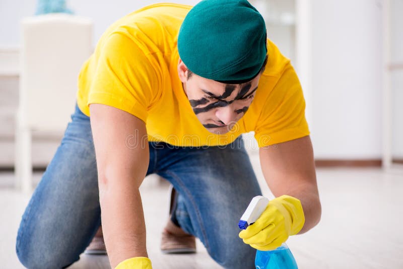 The Man in Military Style Cleaning the House Stock Photo - Image of ...