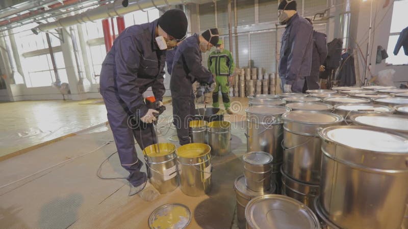 A Worker is Stirring a Self-leveling Floor in a Bucket. the Man Mixes ...