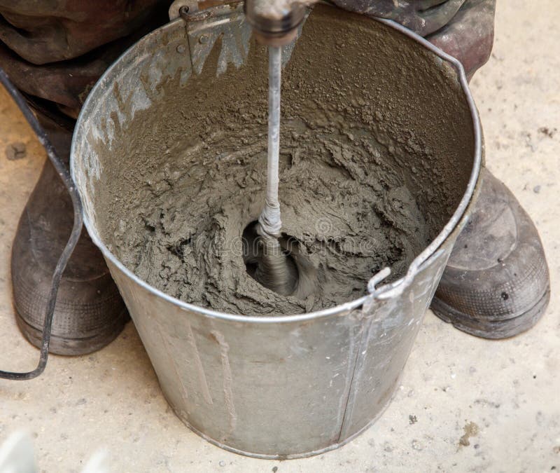 A Man is Mixing Concrete in a Bucket Stock Photo - Image of foundation ...