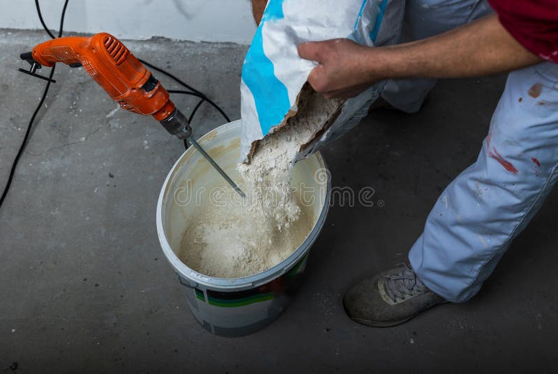 Man Mixing Mass for Plaster Works Stock Photo - Image of building, mass ...