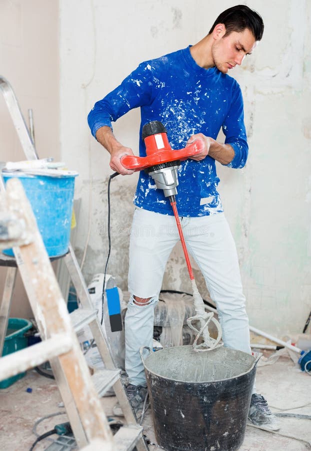 Man Mixing Putty Mixture on Background with Repairable Stock Photo ...