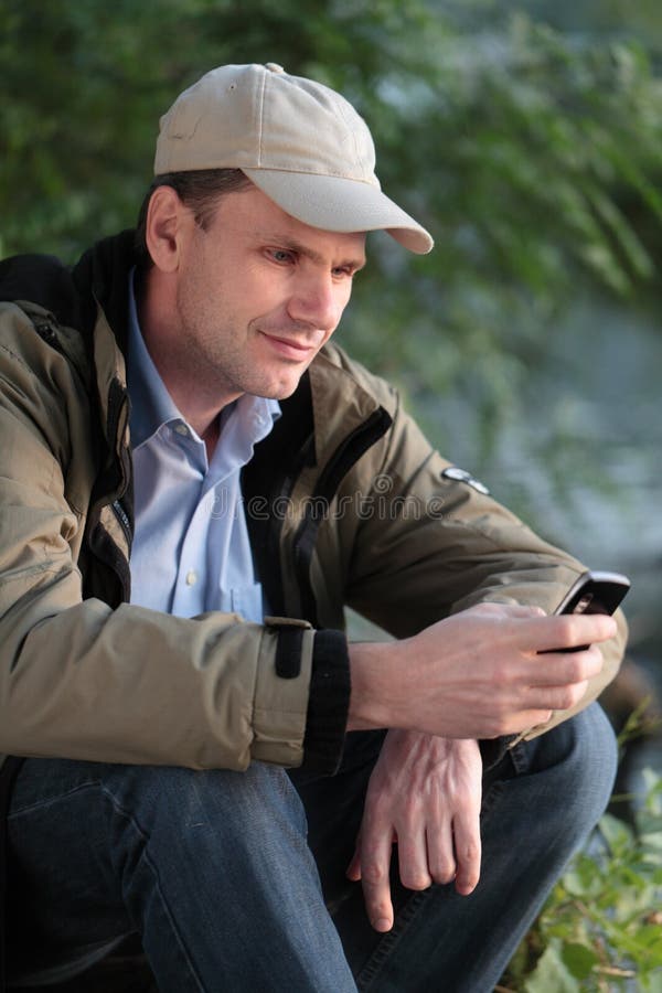 Man with mobile phone stock image. Image of reading, cellular - 22105963