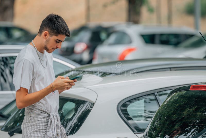 Man with Mobile Phone between Cars Stock Image - Image of assistance ...