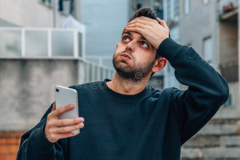 Man with Mobile Phone and Expression of Stress Stock Photo - Image of ...