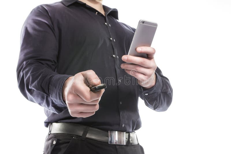 Man with a Mobile Phone in the Hands Using Car Key Isolated on White ...