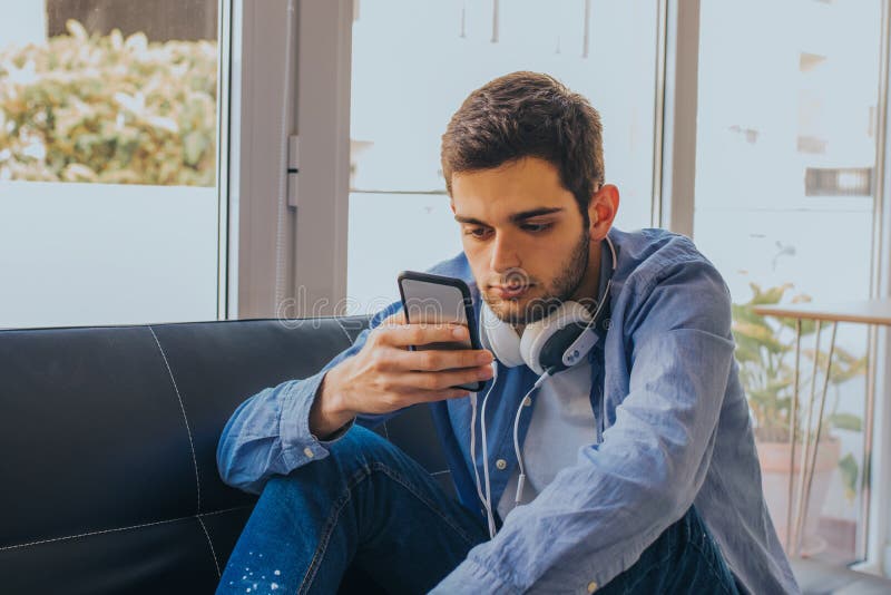 Man with Mobile Phone at Home Stock Photo - Image of adult, beauty ...