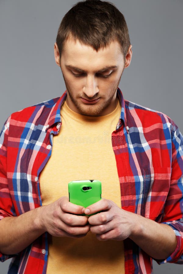 Man with a mobile phone stock photo. Image of young, face - 37843442