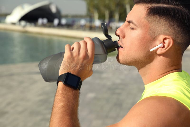 Man with Modern Smart Watch Drinking Water Outdoors Stock Photo - Image ...