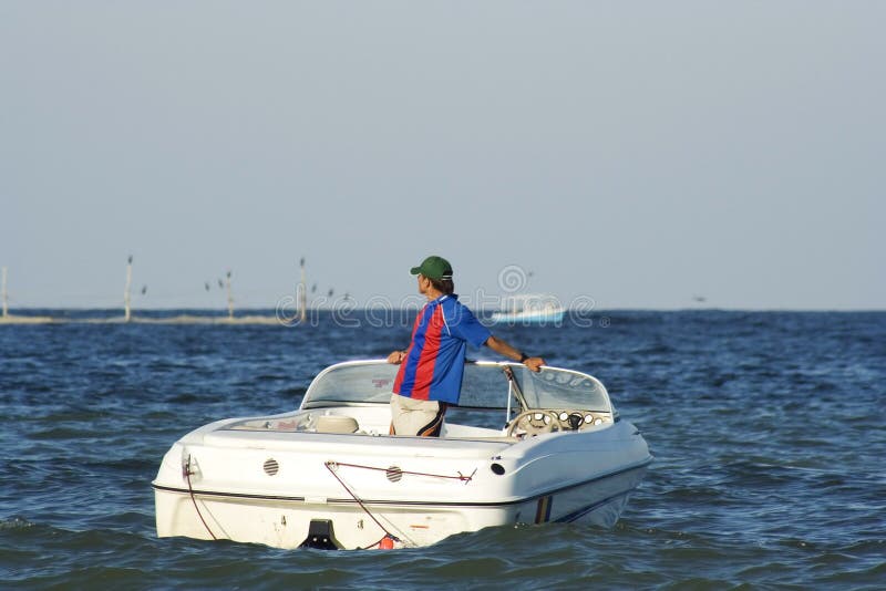 Man in a motor boat stock image. Image of cruising, jolly - 1005821