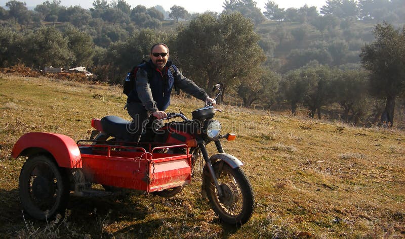 Man on a Motorbike stock image. Image of motorcycle, wheel - 56931797