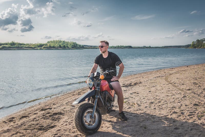 Motorcycle at the beach stock photo. Image of blue, pier - 2514328