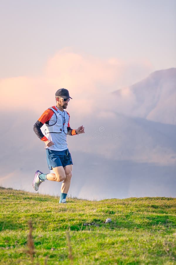 Man Mountain Runner Trains on Meadows Stock Image - Image of workout ...