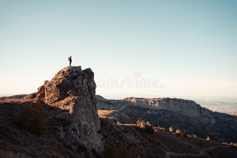 Man in the Mountain at Sunset. Guy Practicing Trekking Stock Image ...