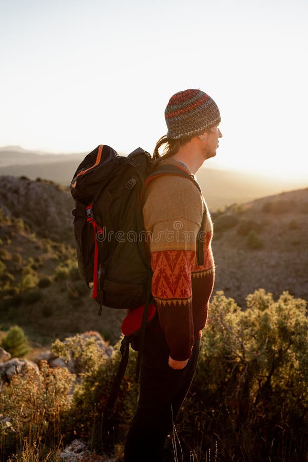 Man in the Mountain at Sunset. Guy Practicing Trekking Stock Image ...