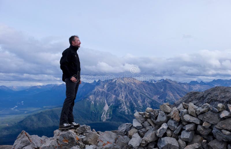 Man on mountain top. stock image. Image of accomplishment - 77941909