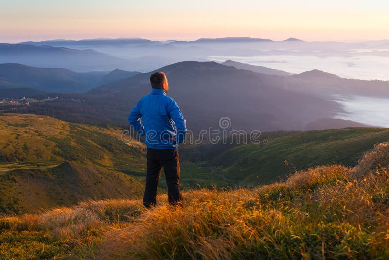 Man in the Mountains Looking into the Distance Stock Image - Image of ...