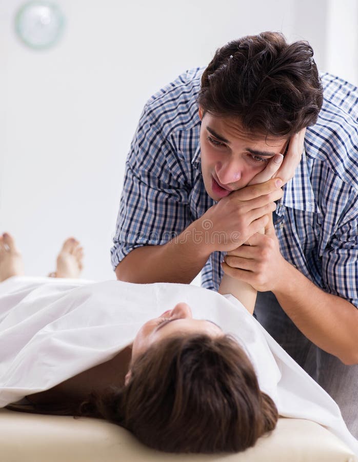 Man mourning his dead wife stock photo. Image of deceased - 182313296